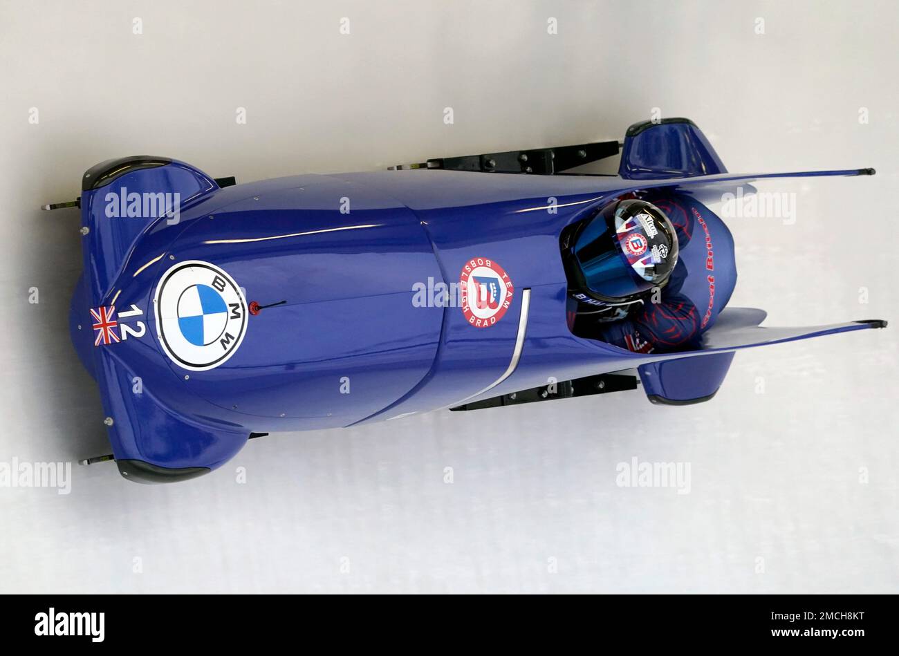 Brad Hall, and Greg Cackett of Great Britain speed down the track ...