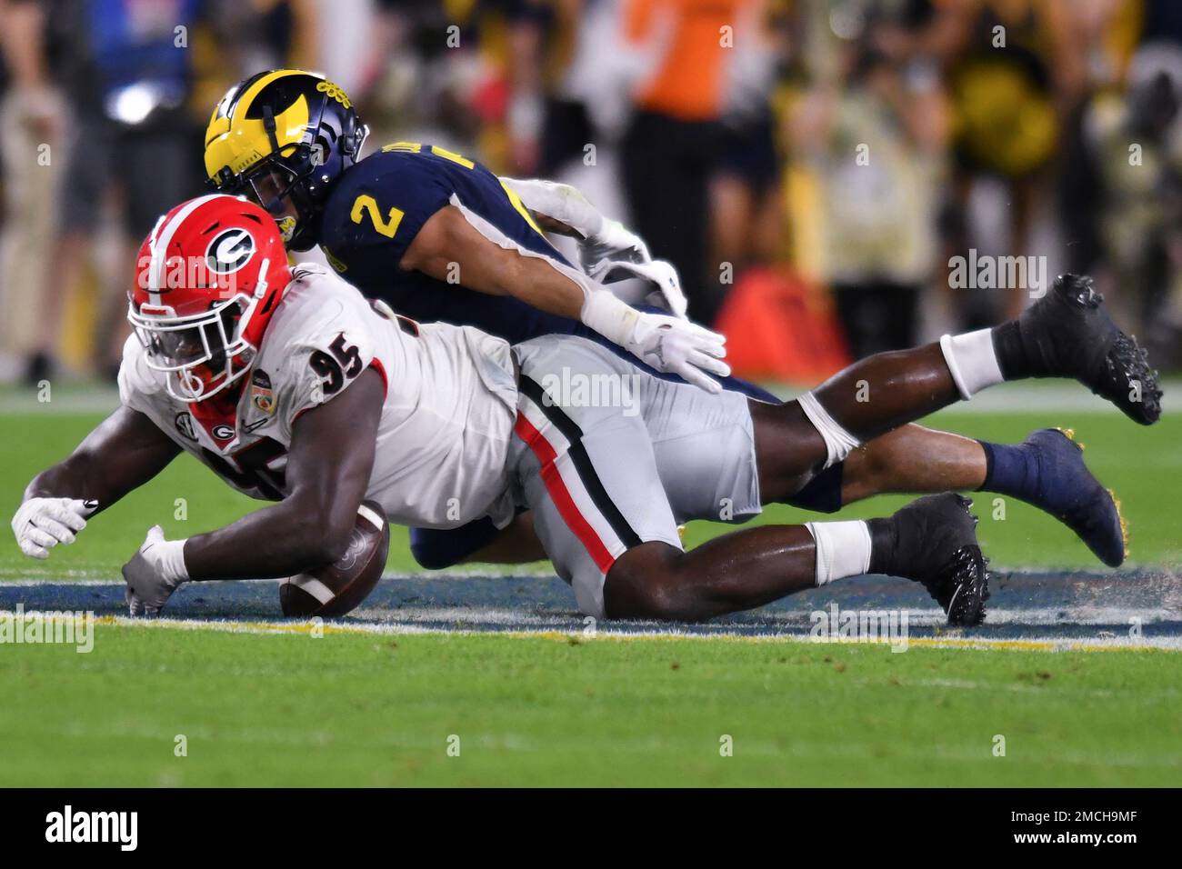 Georgia defensive lineman Devonte Wyatt recovers a fumble by Michigan running back Blake Corum ...