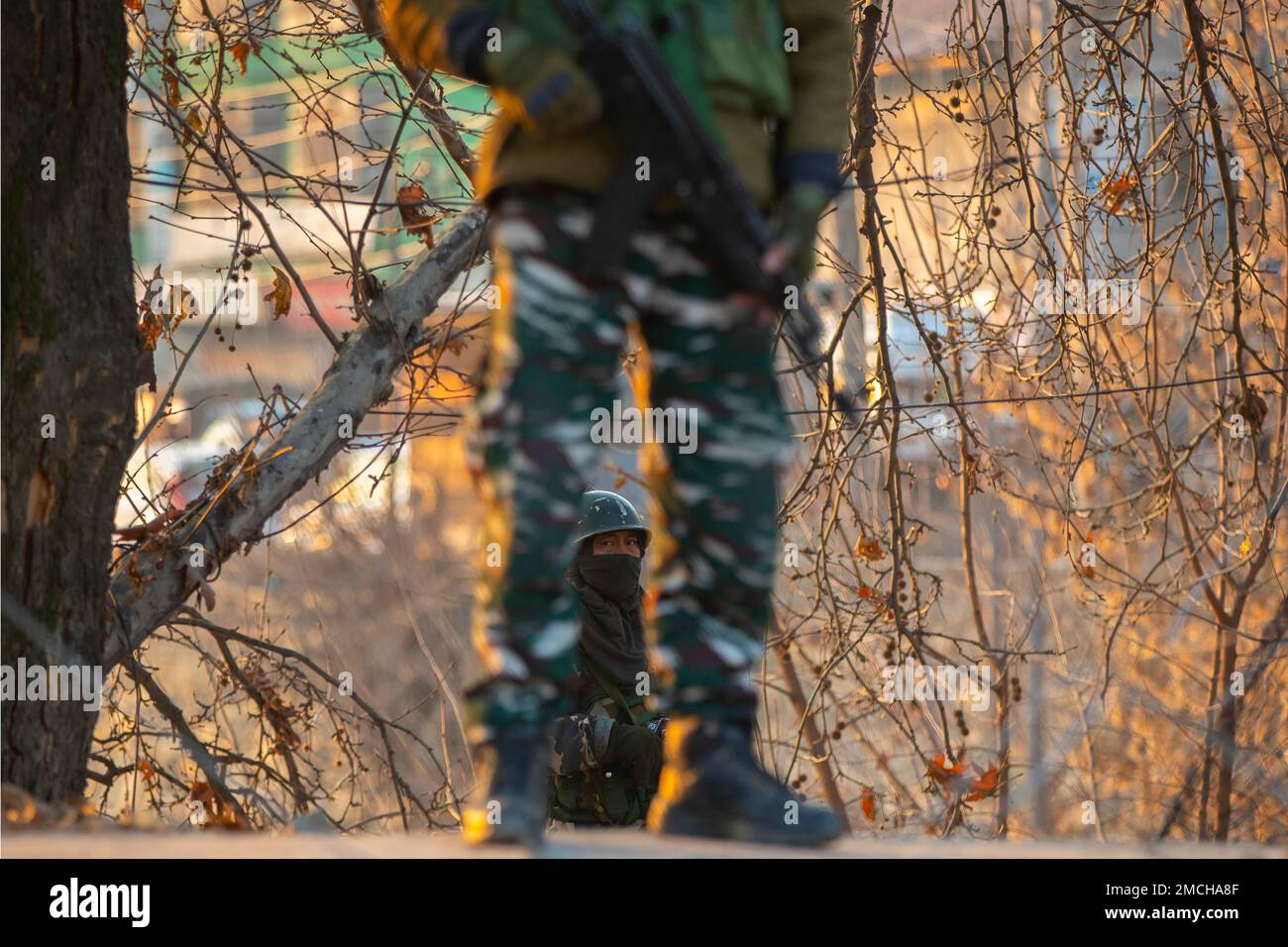 Indian paramilitary soldiers stand guard at a checkpoint in Srinagar ...