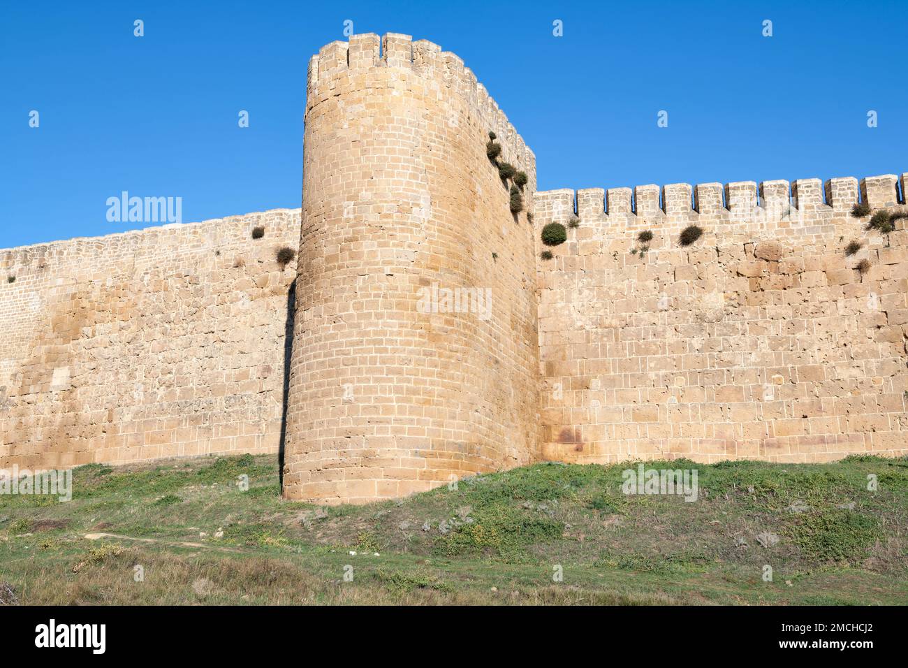 Fortress wall with tower close-up. A fragment of the defensive ...