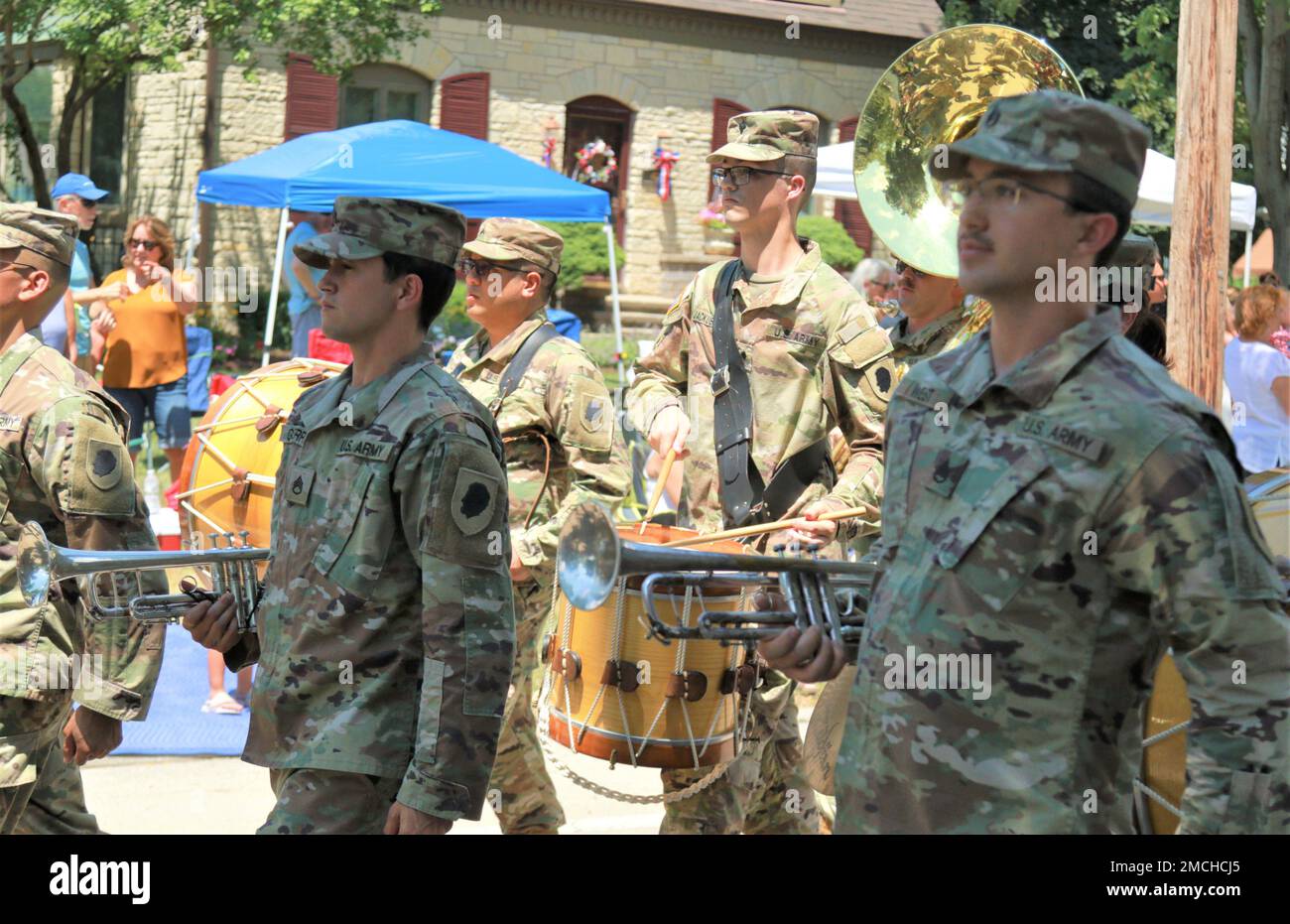 Spc. Andrew Jackubowski plays the drum while marching in Crystal Lake ...