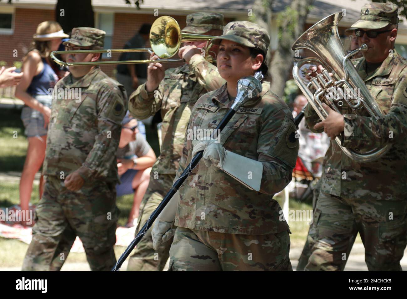 Sgt. Leslie Castro, the drum major, leads her unit in Crystal Lake ...