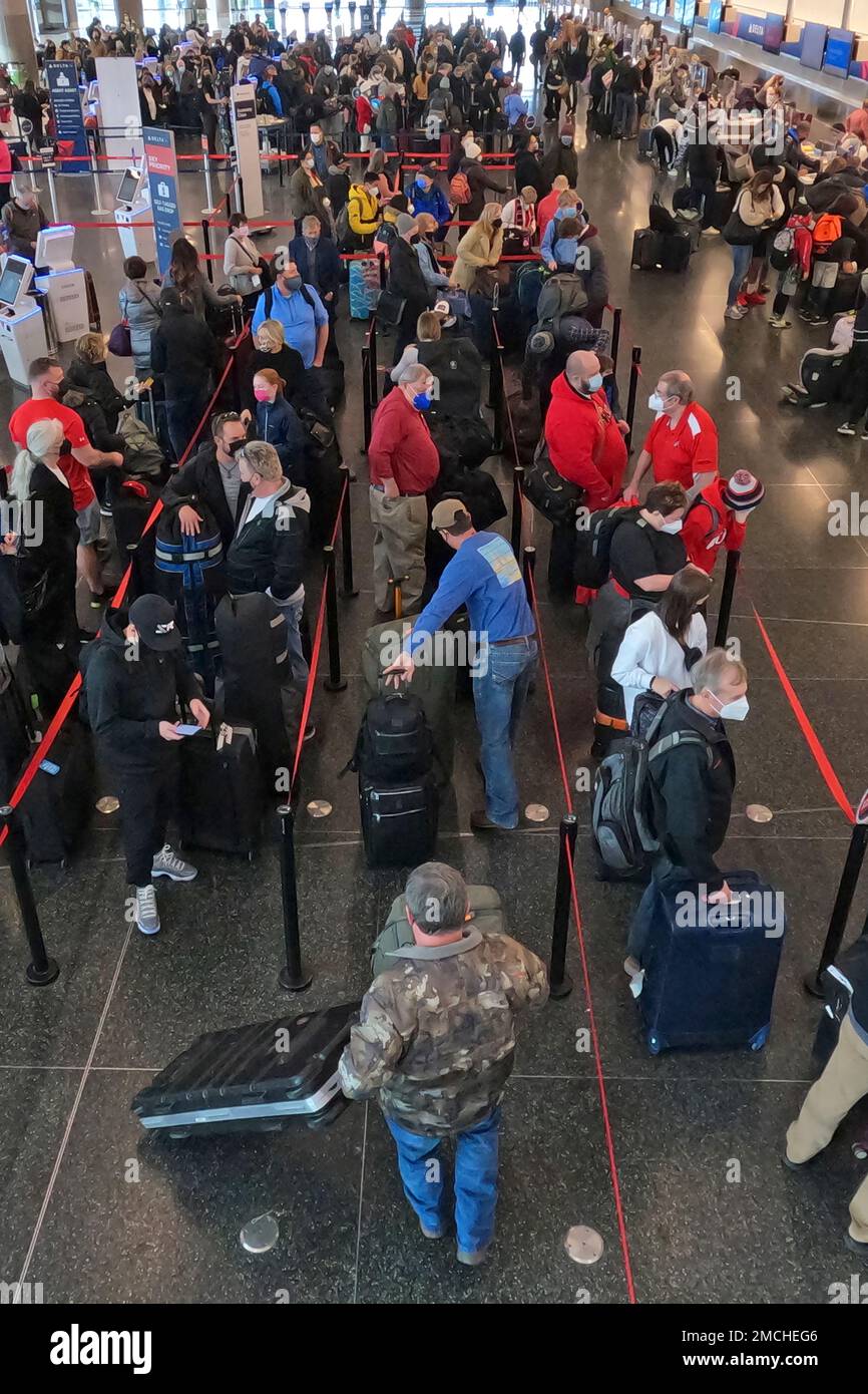 Travellers line up at a Delta ticket counter at Salt Lake City ...