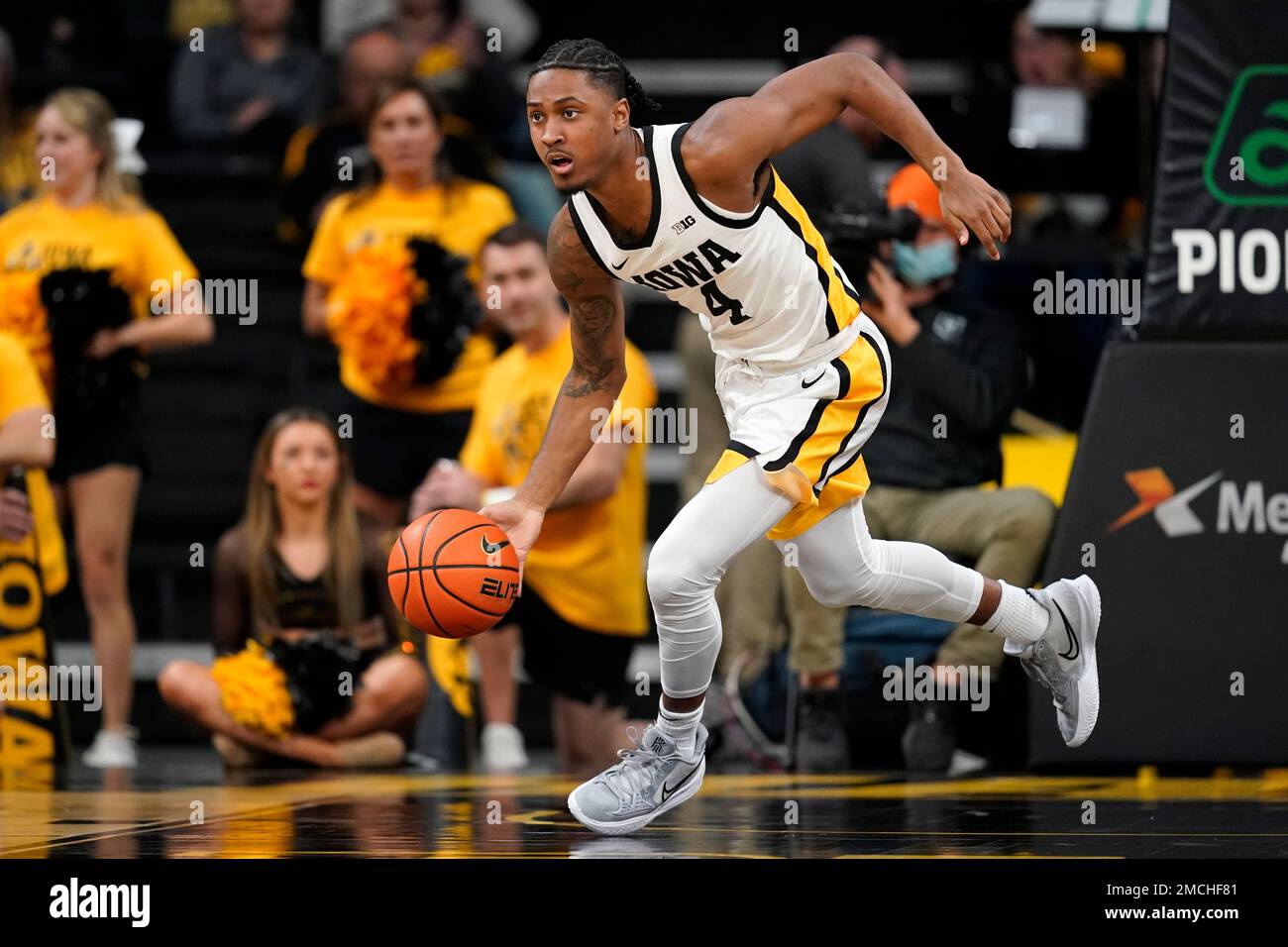 Iowa guard Ahron Ulis (4) drives up court during the second half of an ...