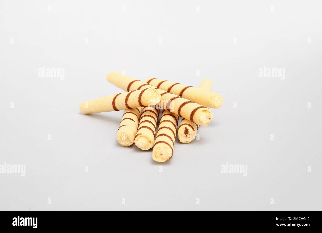 Tasty wafer rolls on grey background Stock Photo - Alamy
