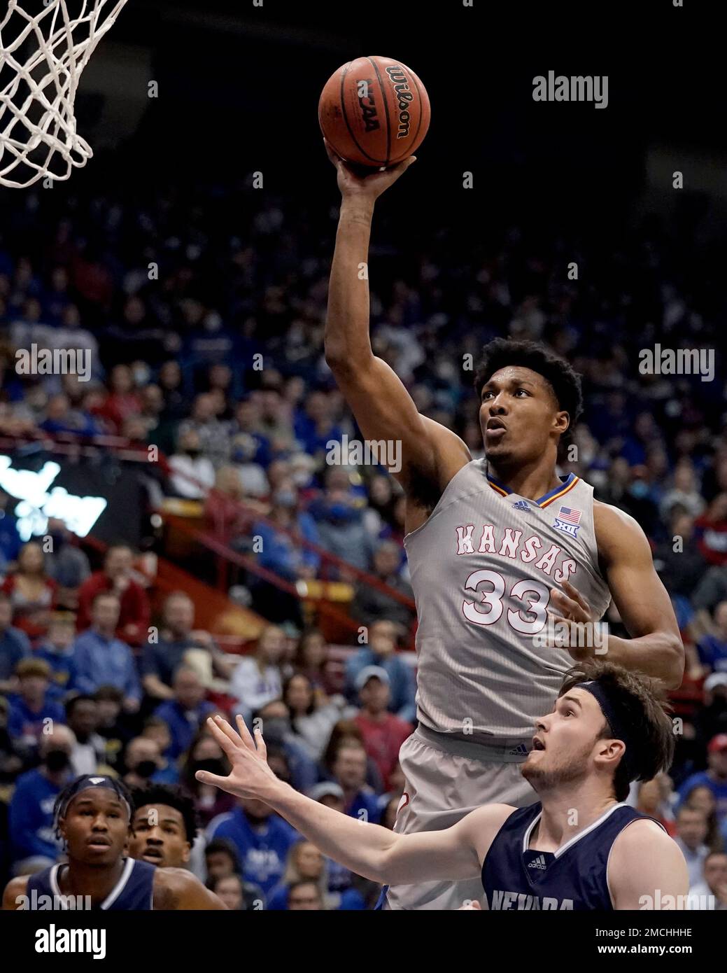 Kansas' David McCormack (33) shoots over Nevada's Will Baker during the ...