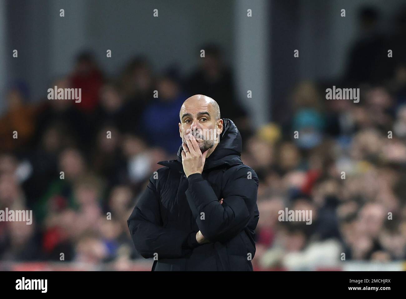 Manchester City's head coach Pep Guardiola watches during the English ...