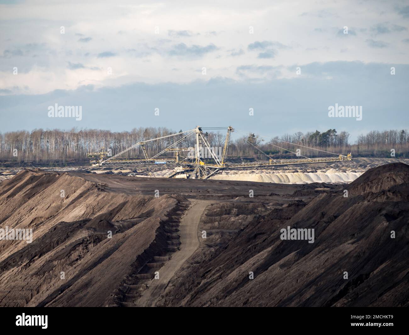 Mining machinery in an open pit. Heavy equipment for the transportation ...