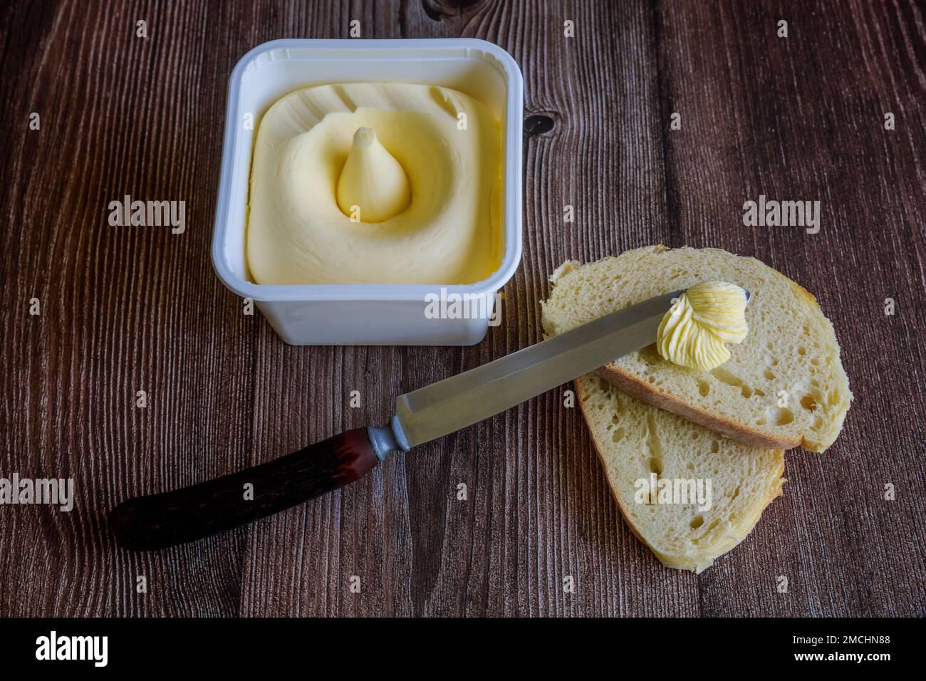 Spreading creamy butter on slice hi-res stock photography and images ...