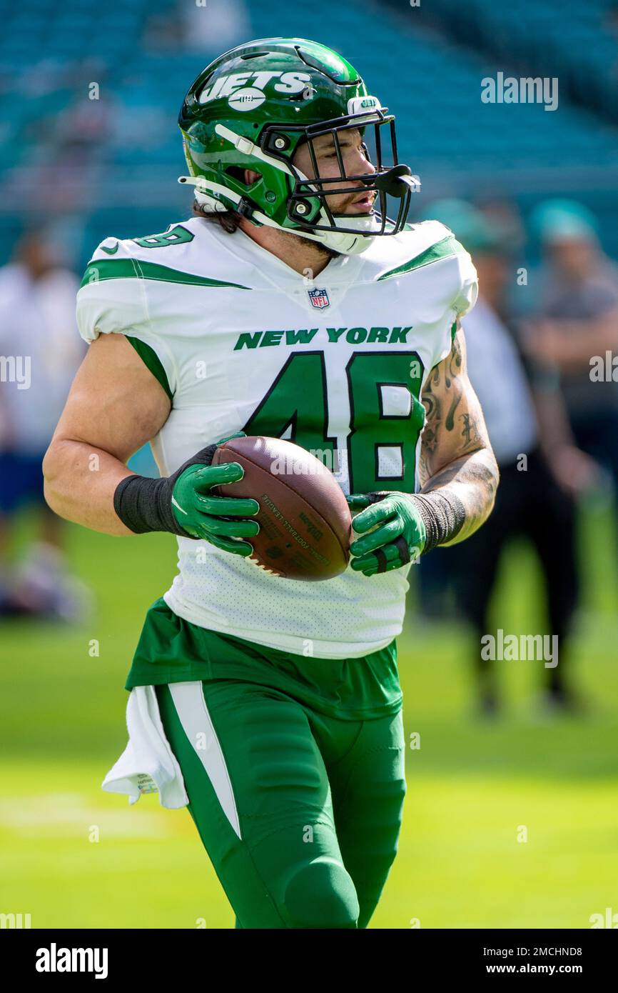 New York Jets fullback Nick Bawden (48) holds the ball on the field ...