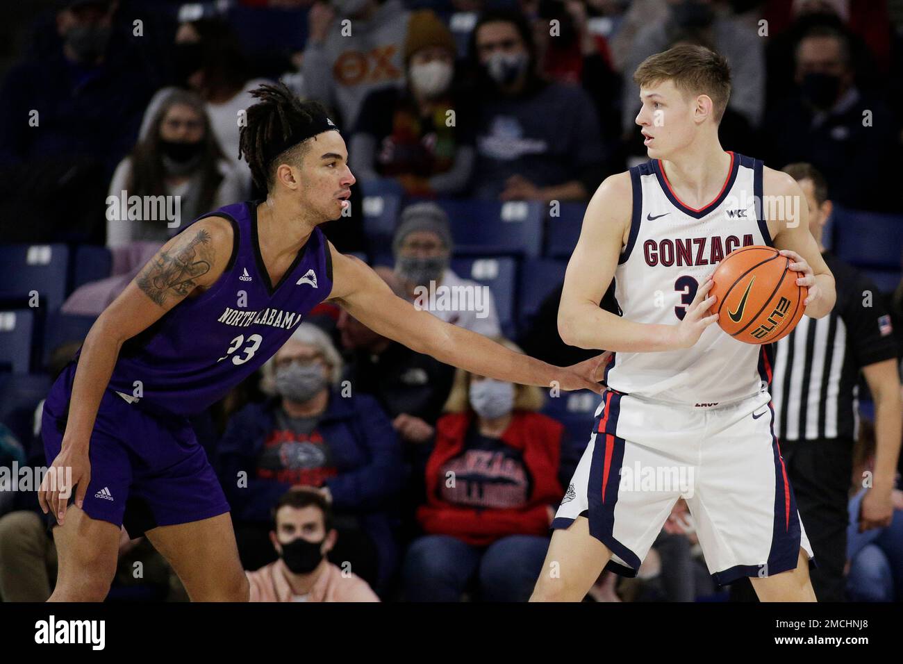 Gonzaga forward Ben Gregg, right, controls the ball while defended by ...
