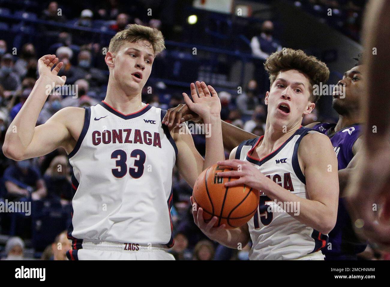 Gonzaga guard Joe Few (15) grabs a rebound next to teammate forward Ben ...