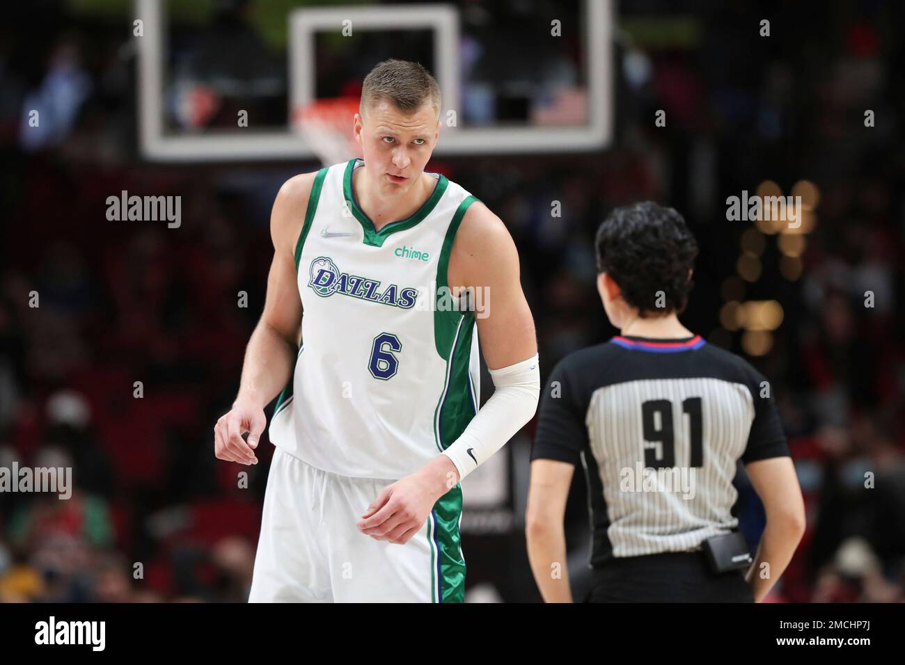 Dallas Mavericks center Kristaps Porzingis talks with referee Cheryl ...