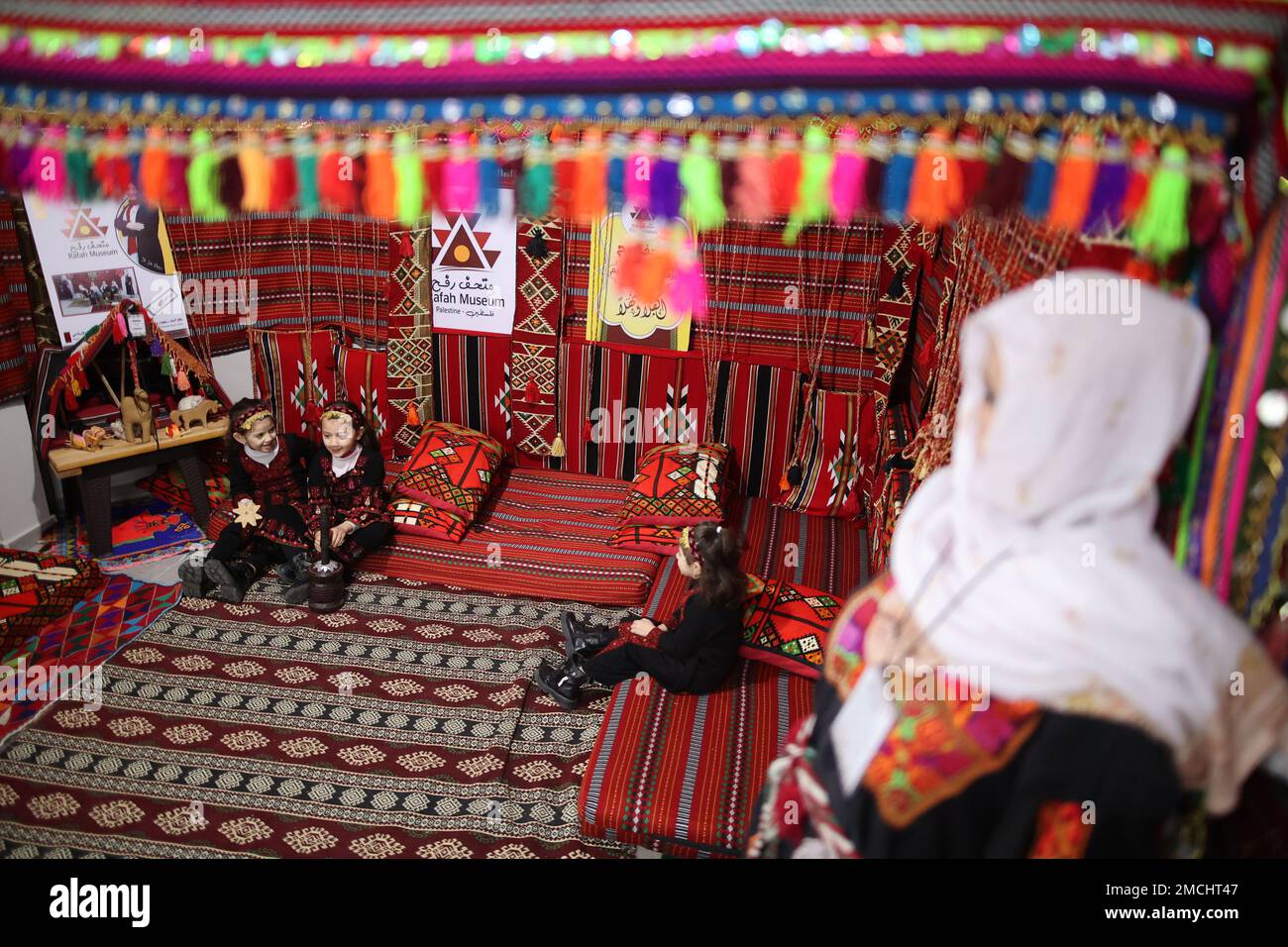 Grandchildren of Suhaila Shaheen, 60, set in a traditional tent inside ...