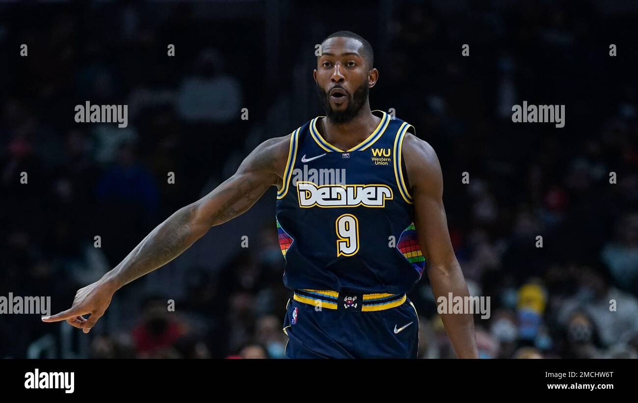 Denver Nuggets guard Davon Reed (9) points during an NBA basketball ...