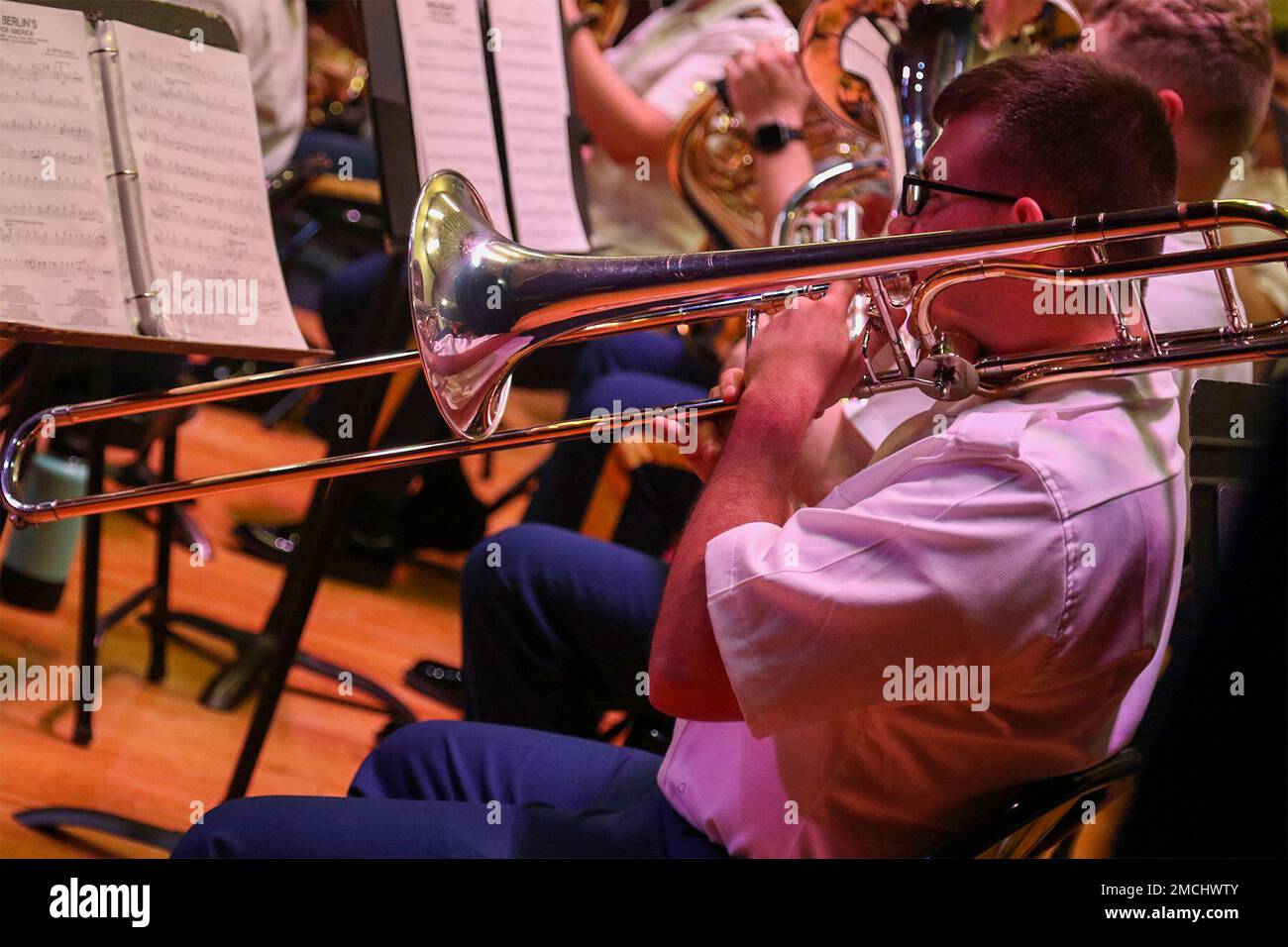A Soldier with the 1st Infantry Division Band plays the trombone during ...