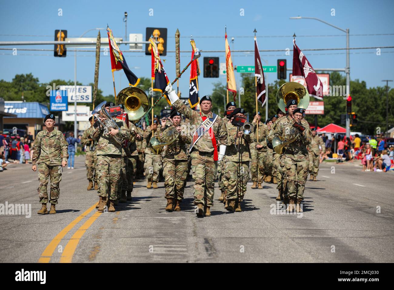 The 1st Infantry Division Band marches at the head of a formation of ...