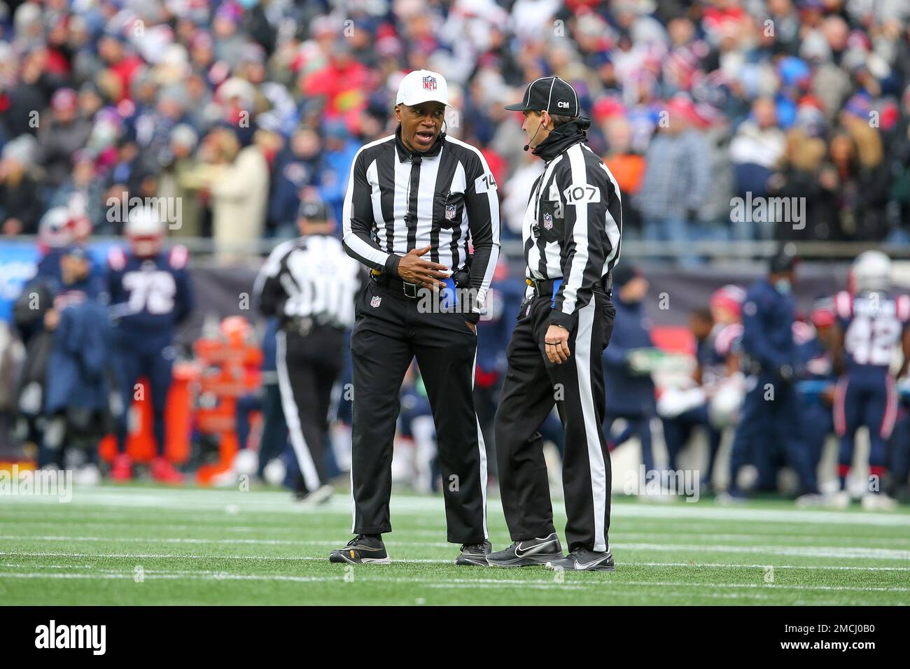 Referee Shawn Smith (14) talks with side judge Dave Hawkshaw (107 ...