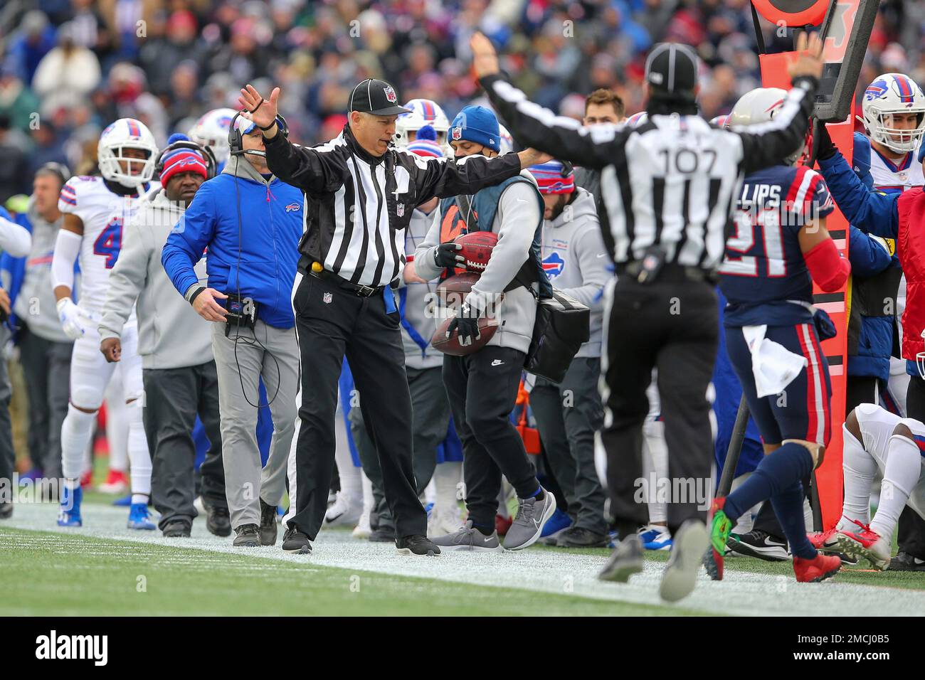 Down judge Mark Hittner (28) and side judge Dave Hawkshaw (107) signal ...