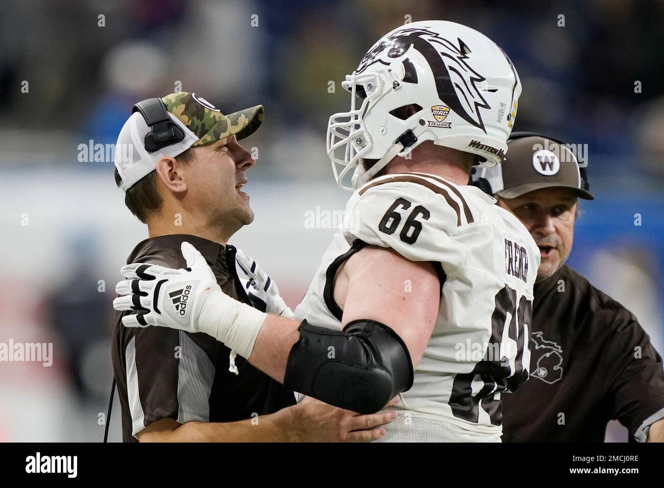 Western Michigan head coach Tim Lester talks with offensive lineman ...