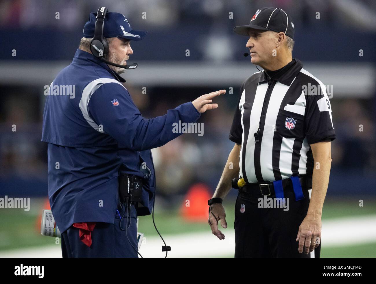Dallas Cowboys head coach Mike McCarthy, left, argues a call line judge ...