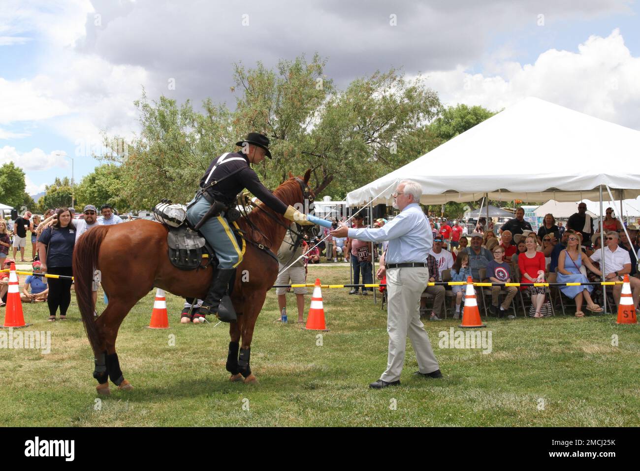 A mounted member (left) of Fort Huachuca's 4th Cavalry B Troop delivers ...