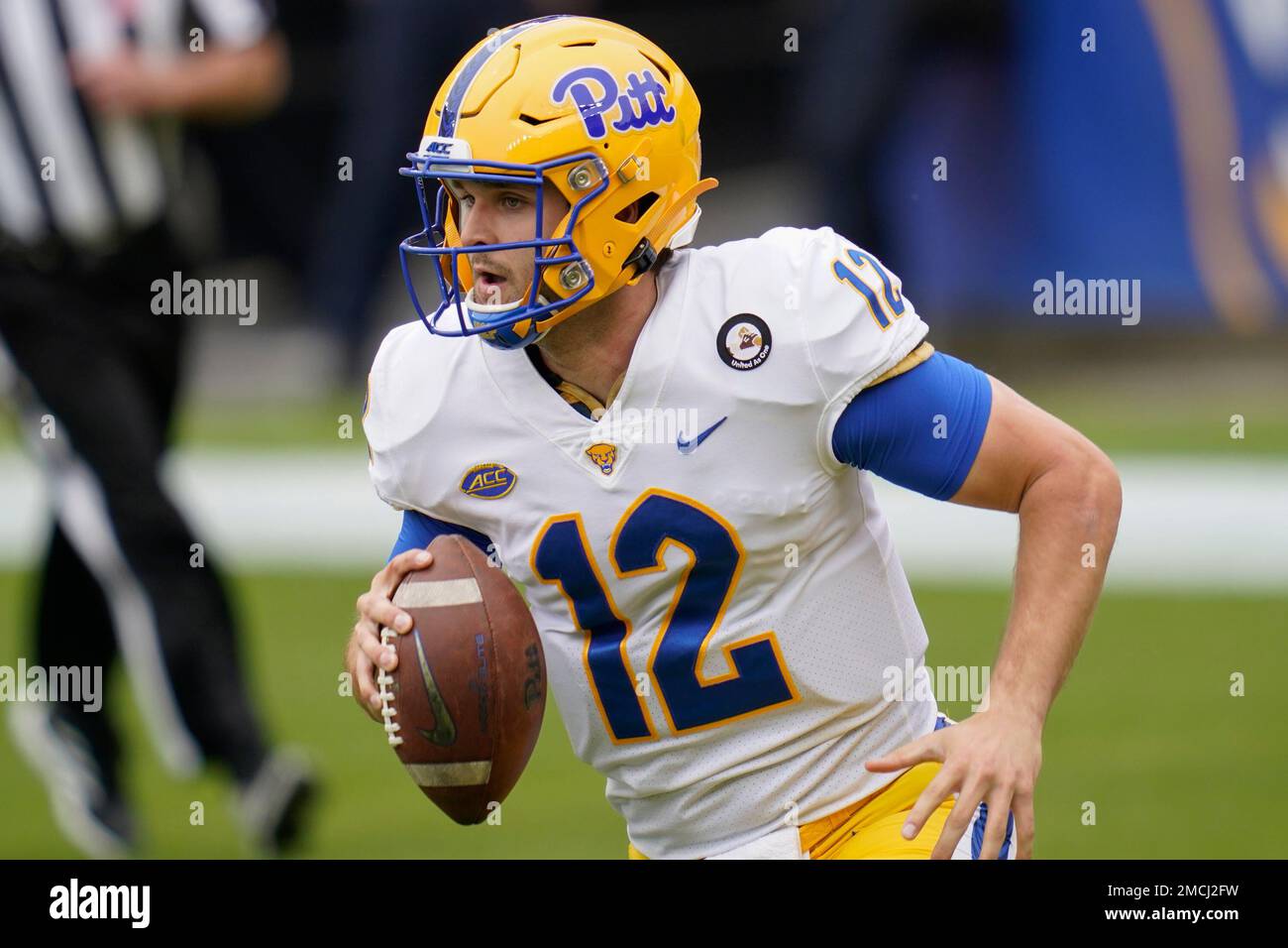 FILE - Pittsburgh quarterback Nick Patti (12) scrambles during their ...