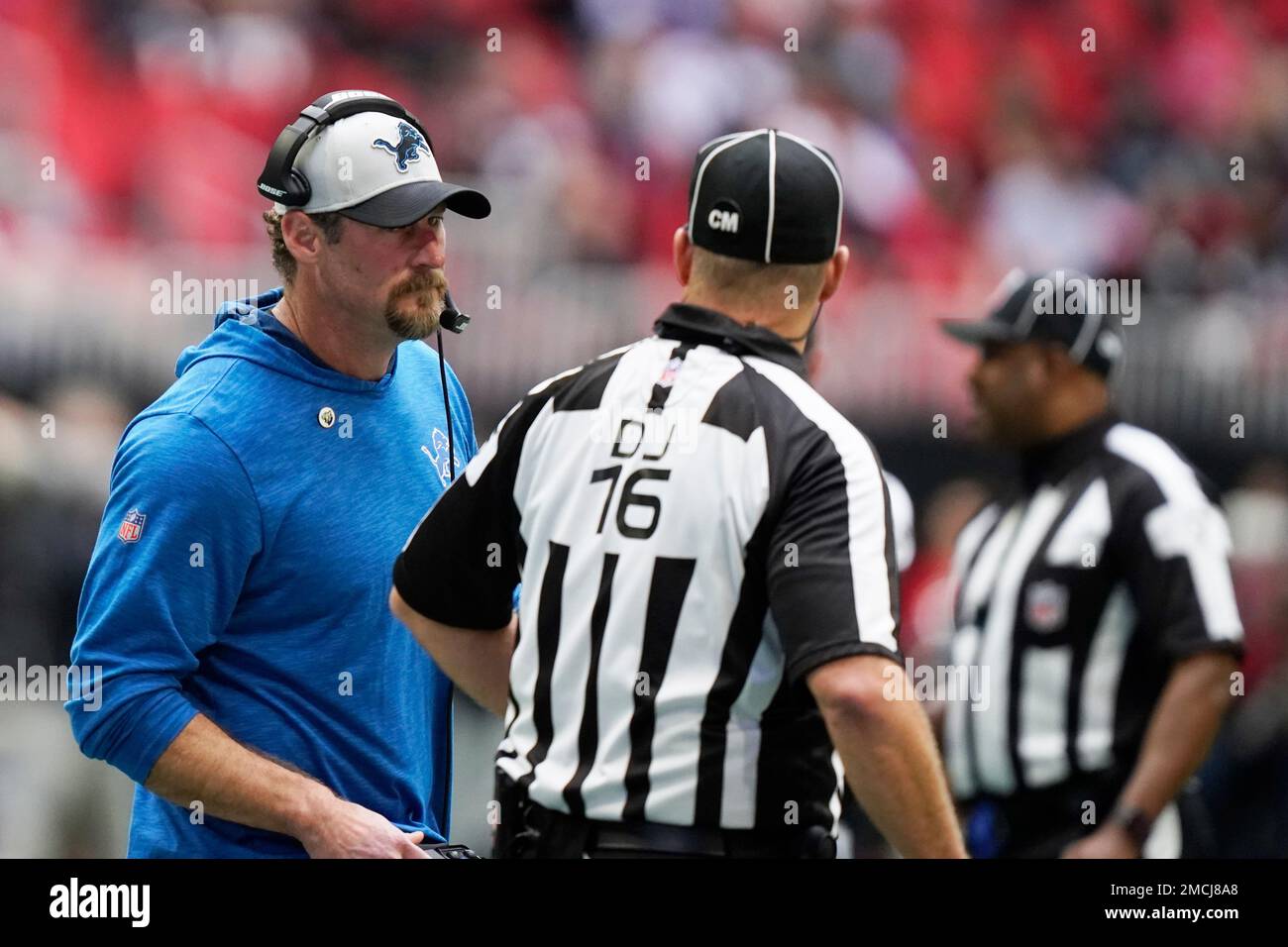 Detroit Lions head coach Dan Campbell speaks with down judge Kevin ...