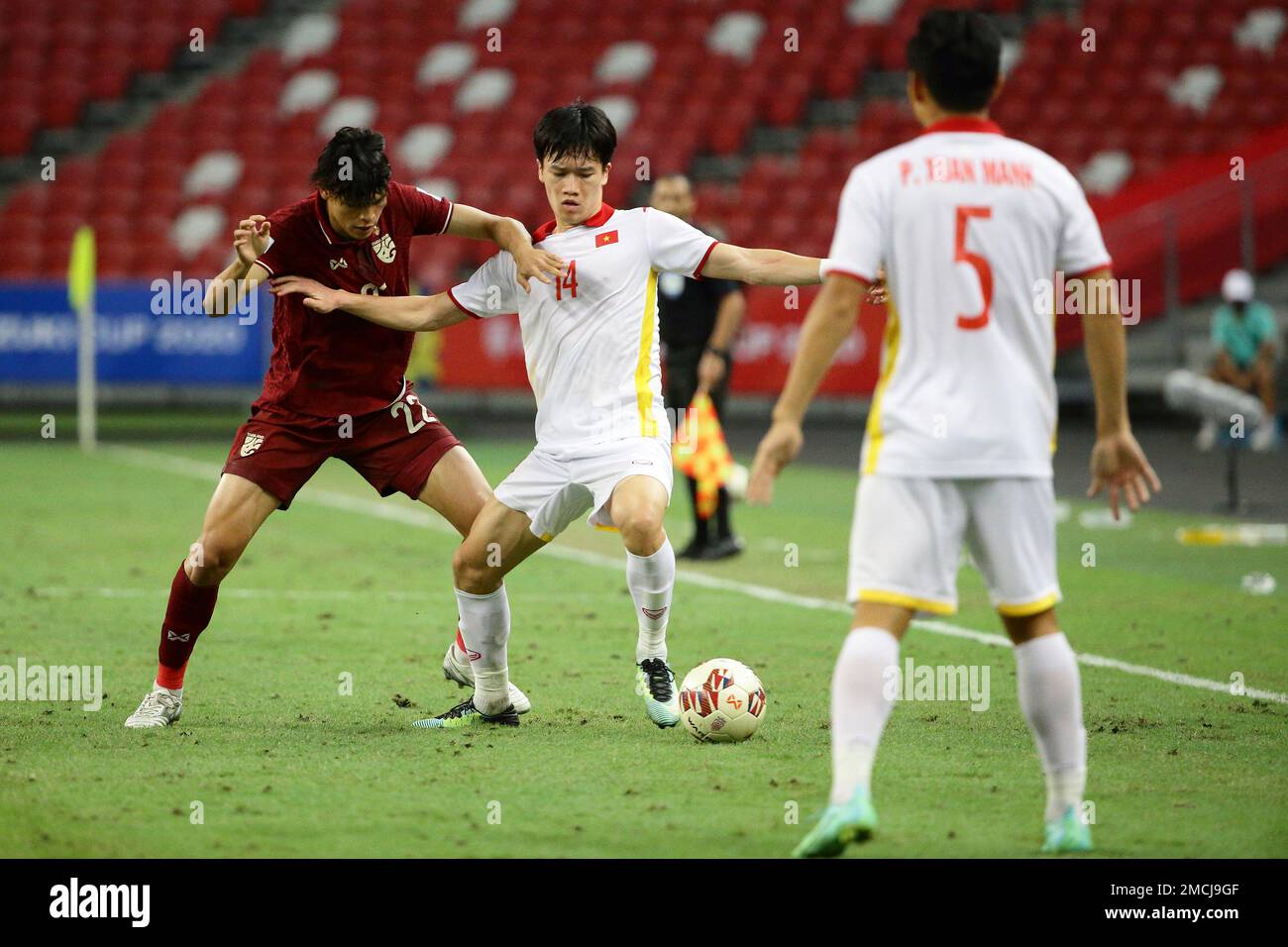 Supachai Jaided of Thailand, right, and Nguyen Hoang Duc of Vietnam compete for the ball during ...