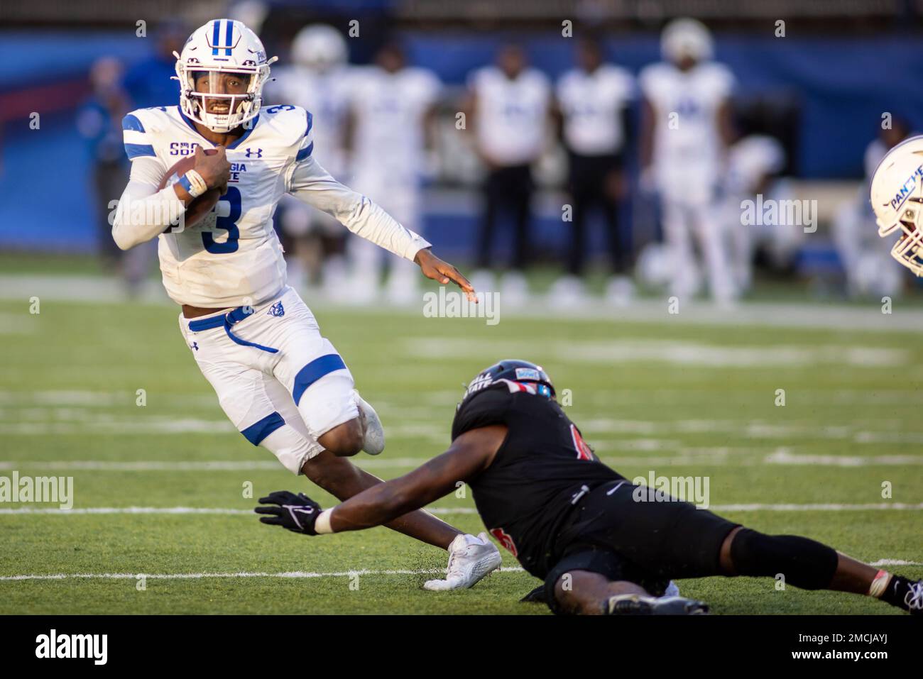 Georgia State quarterback Darren Grainger (3) runs past Ball State ...