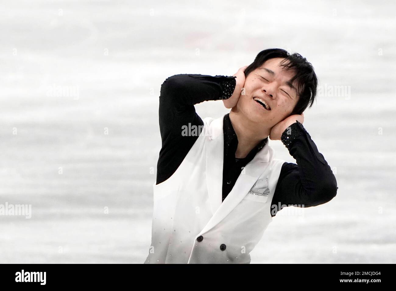 Yuma Kagiyama of Japan reacts after performing during men's short ...