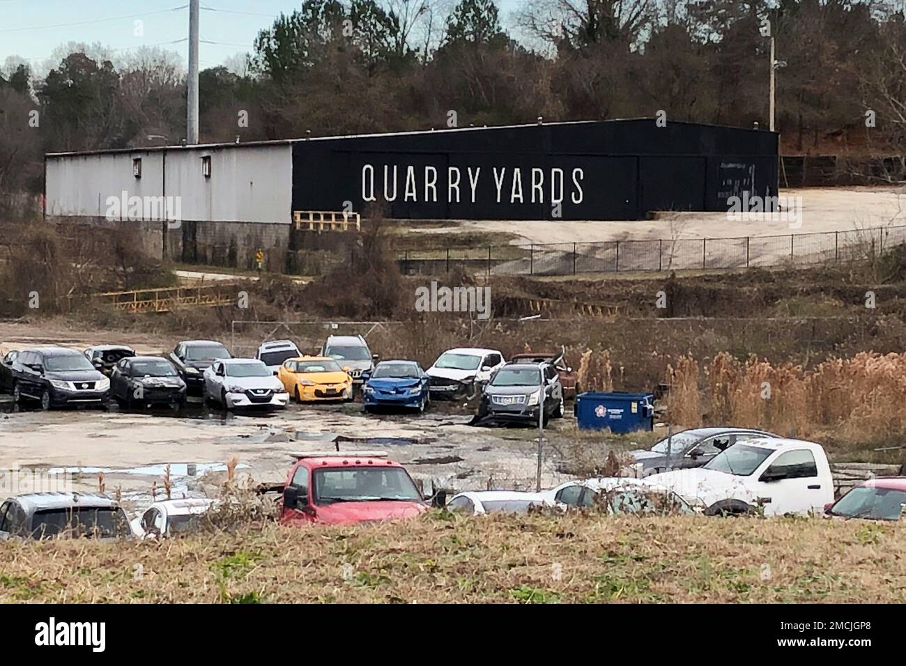 A Quarry Yards building is seen next to abandoned cars on Atlanta's ...