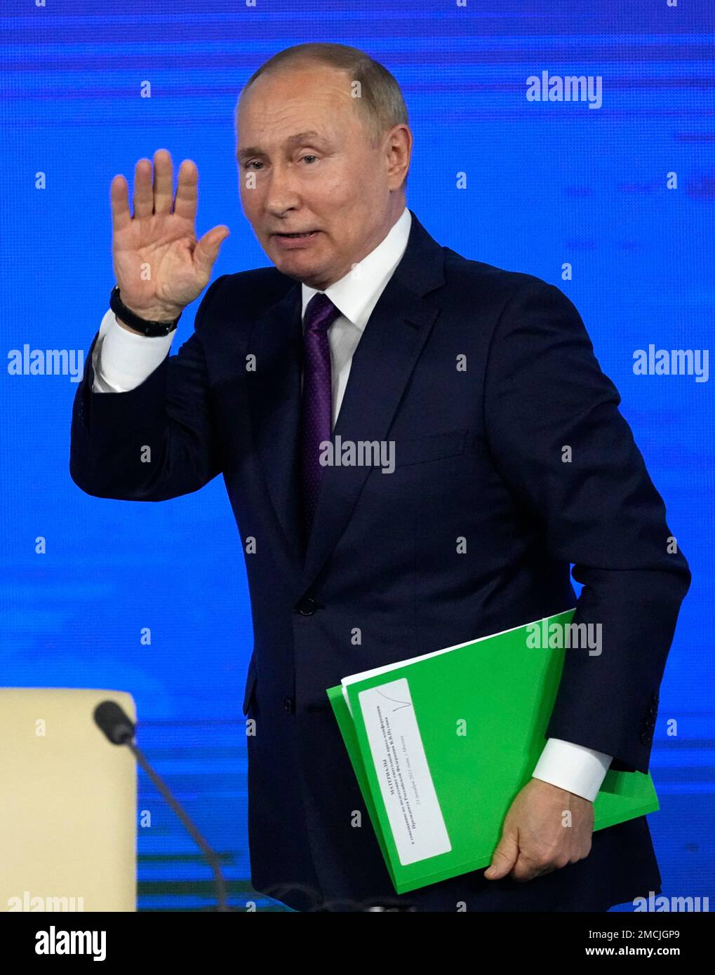 Russian President Vladimir Putin waves after his annual news conference ...