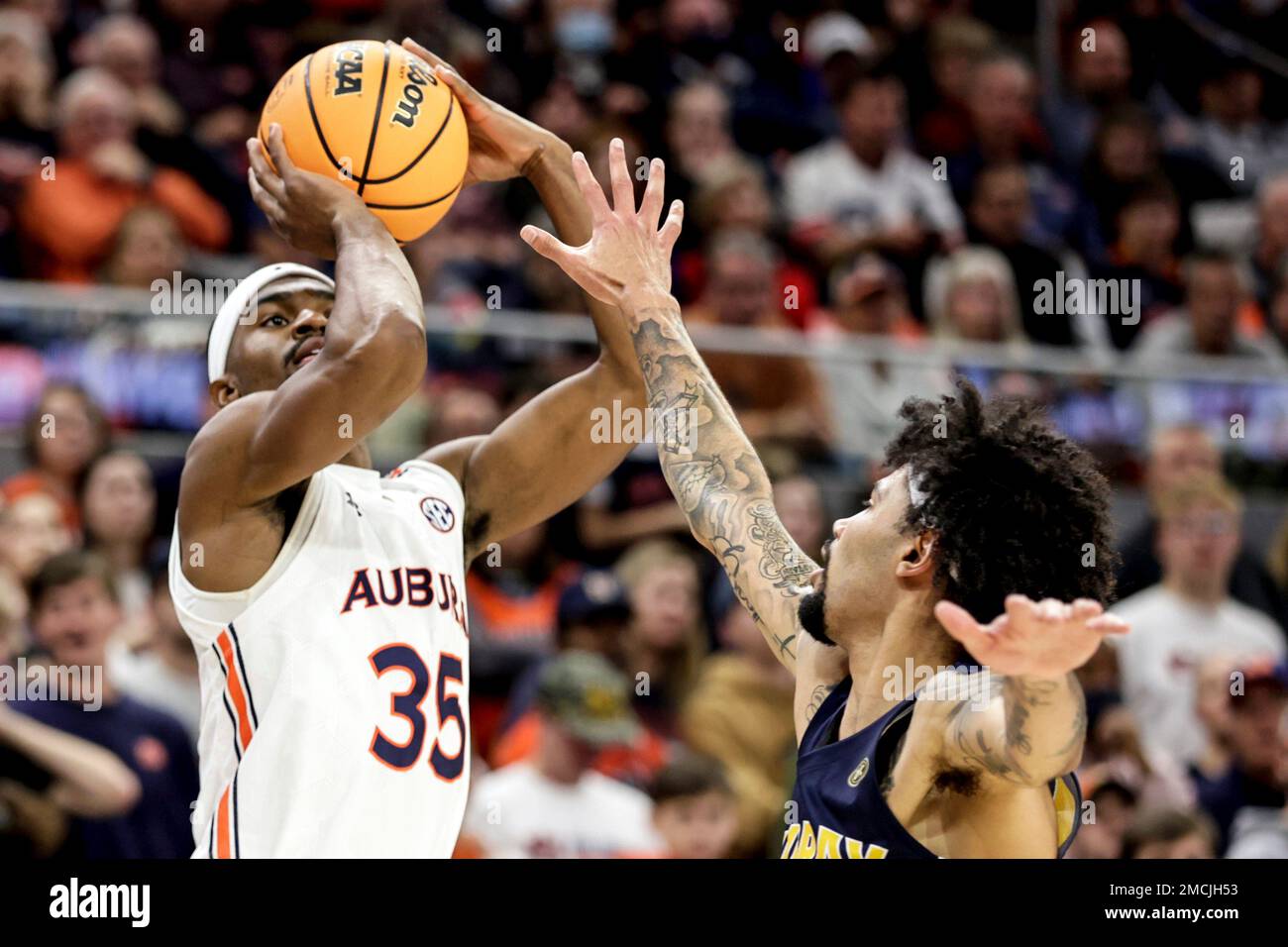Auburn guard Devan Cambridge (35) puts up a three pointer over Murray ...
