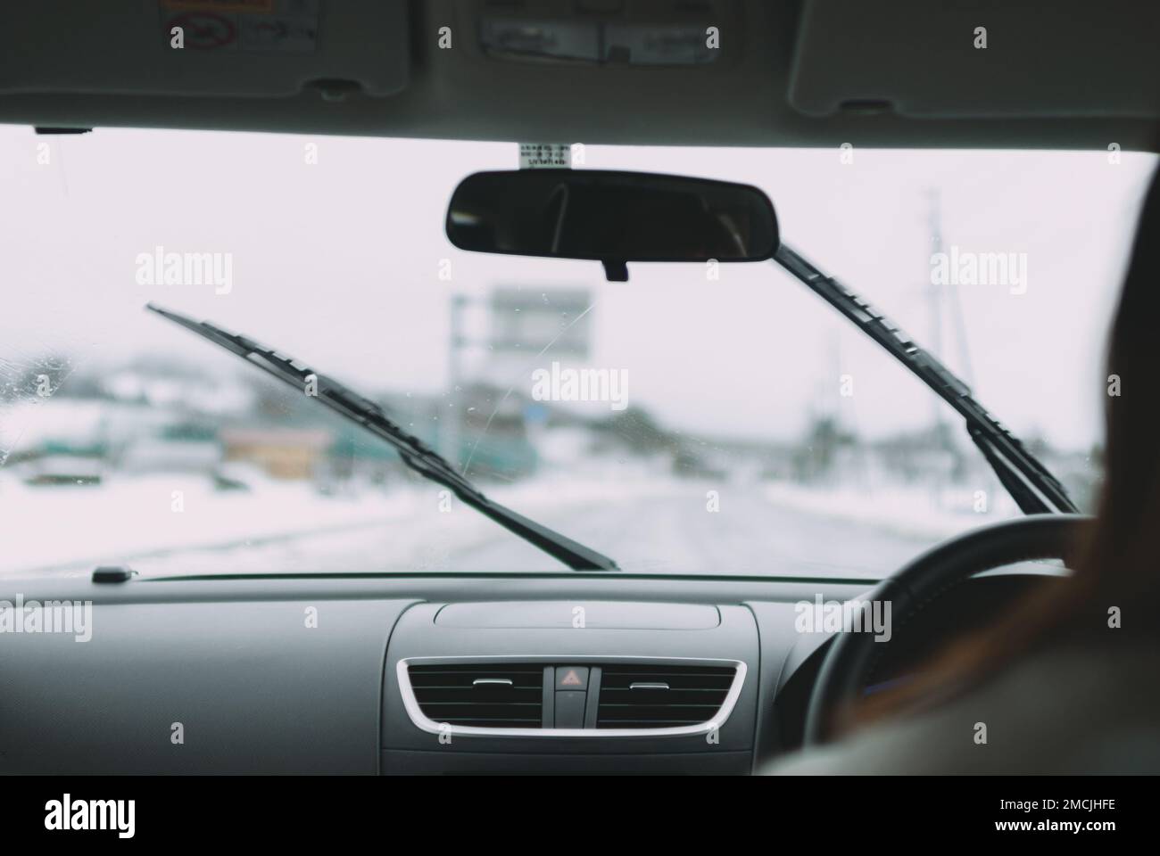 Front view of the road during snowy winter in Japan, from inside of the ...