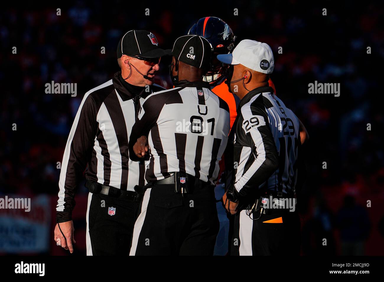 Umpire Roy Ellison (81) and referee Adrian Hill (29) talk during the ...