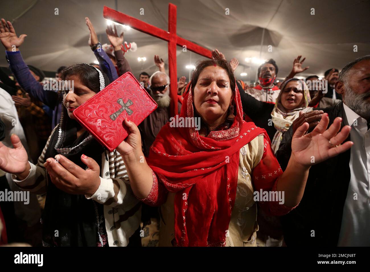 Pakistani Christians pray during a celebration for Christmas, in Lahore ...