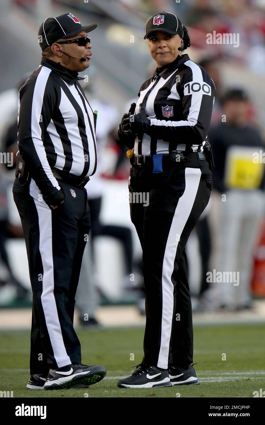 Line judge Maia Chaka (100) and field judge James Coleman (95) talk ...