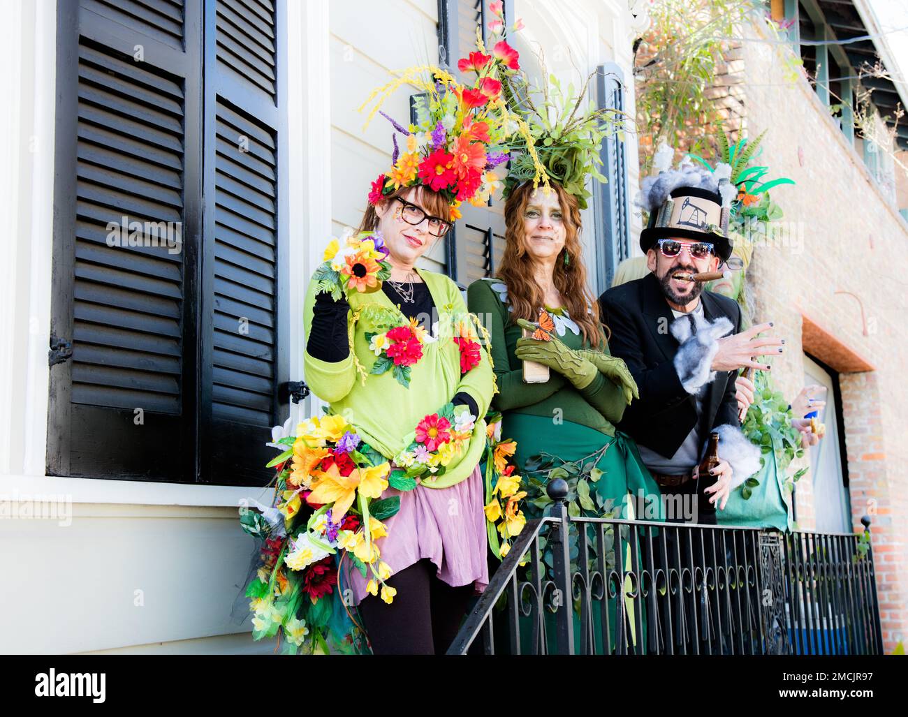 Happy participants in the Walking Parade of St. Anne during Mardi Gras ...