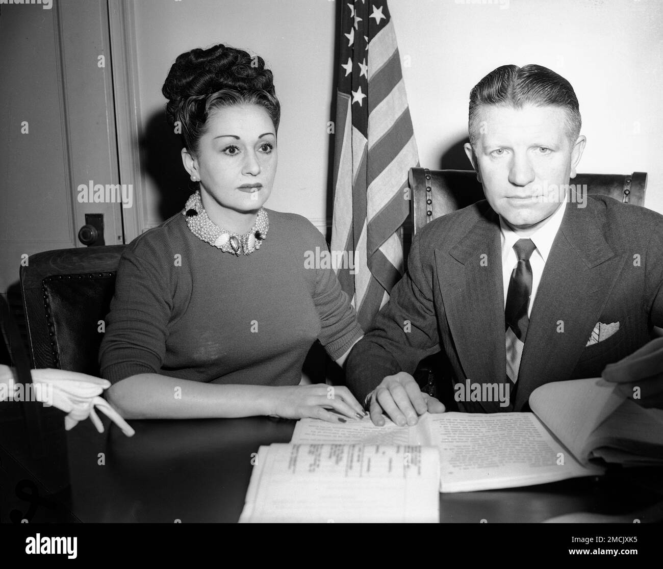 Mrs. Anna Genovese goes over documents with her attorney Osie M. Silber ...