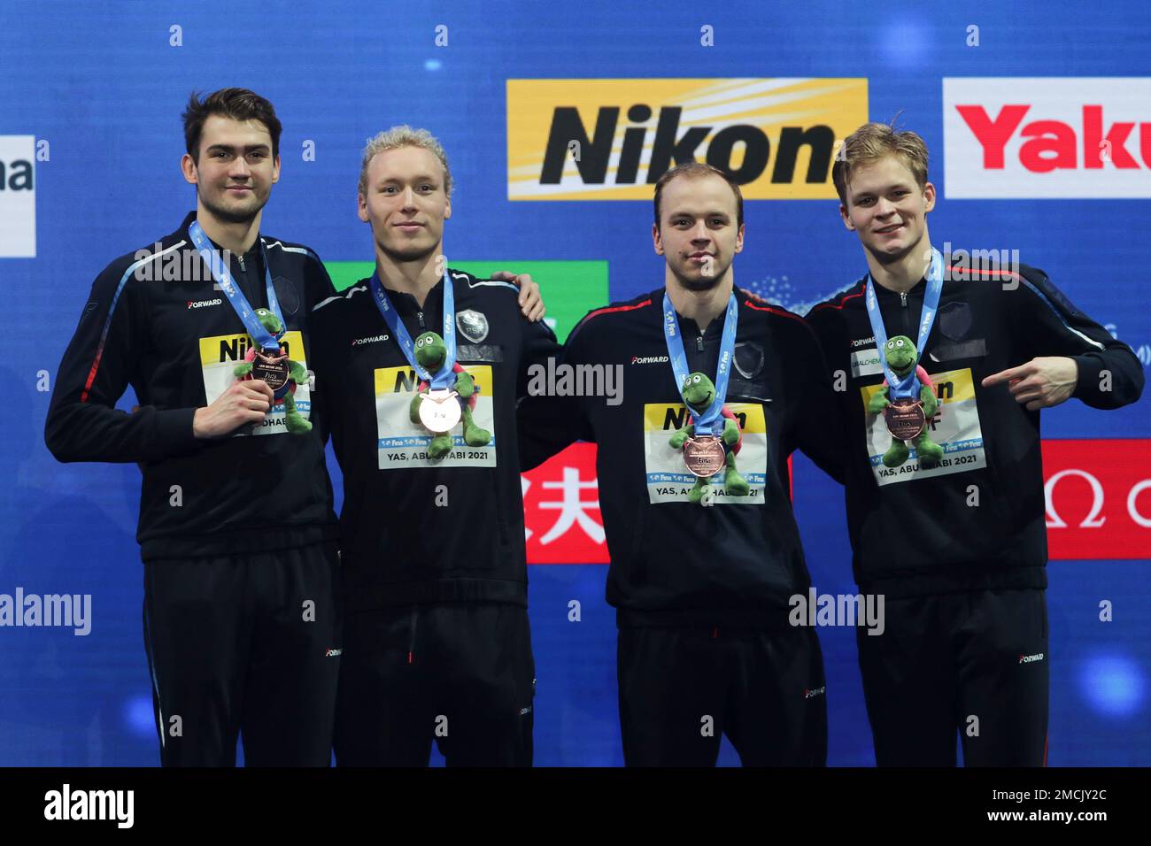 Team Russia stands on the podium after winning bronze in the 4x100 ...