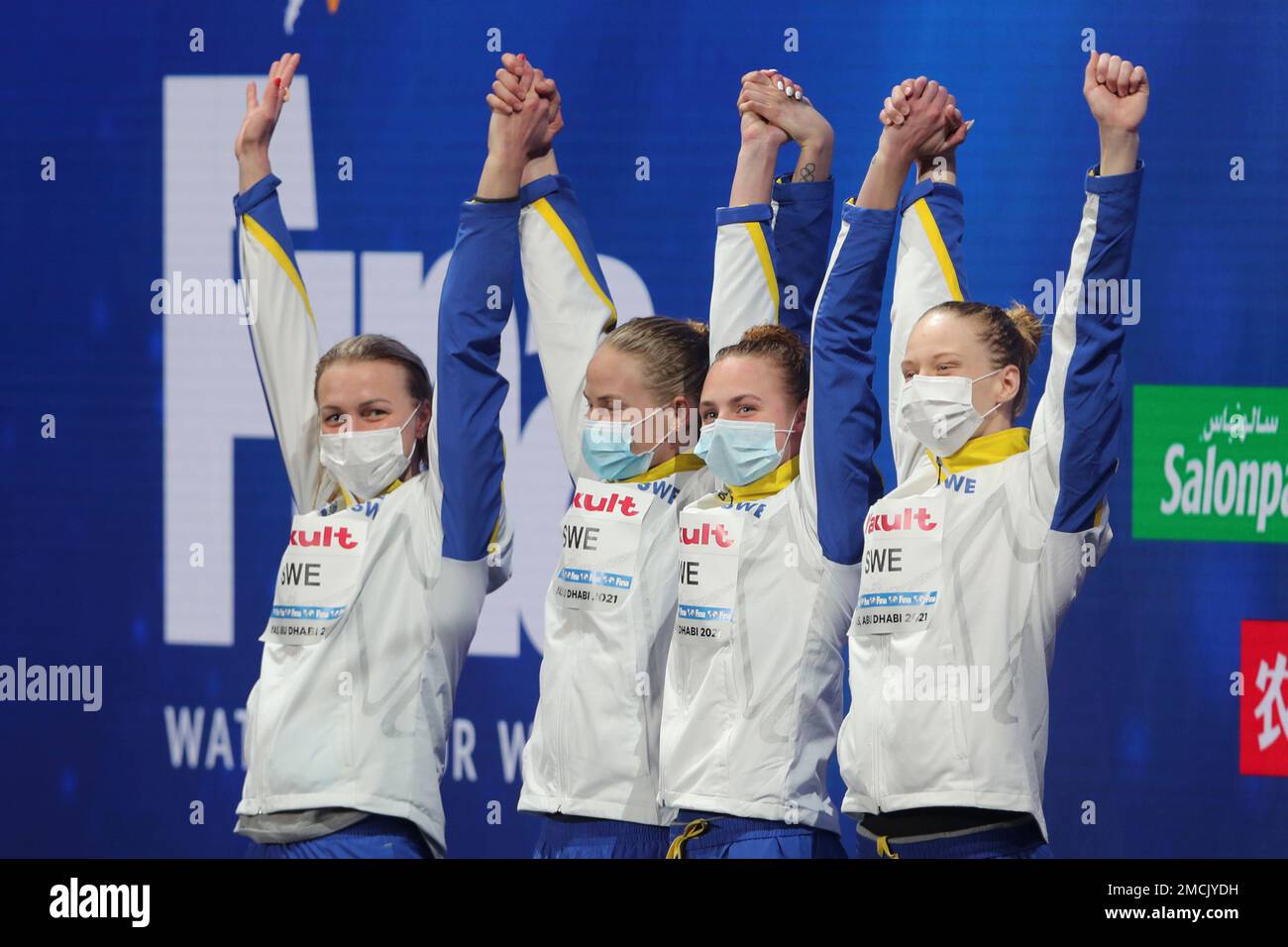 Team Sweden stand on the podium after winning bronze in 4x50 meters ...