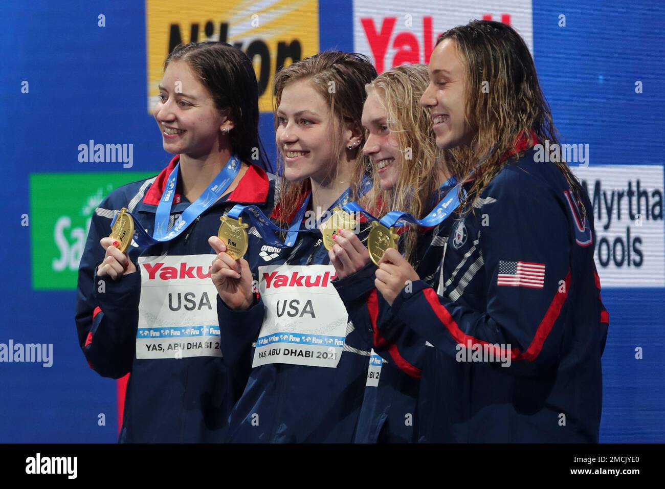 Team USA stand on the podium after winning gold in 4x50 meters ...