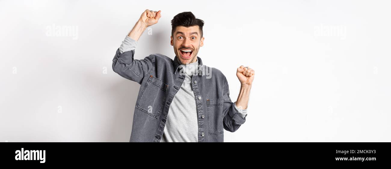 Excited man shouting from joy, winning prize and rejoicing, raising ...