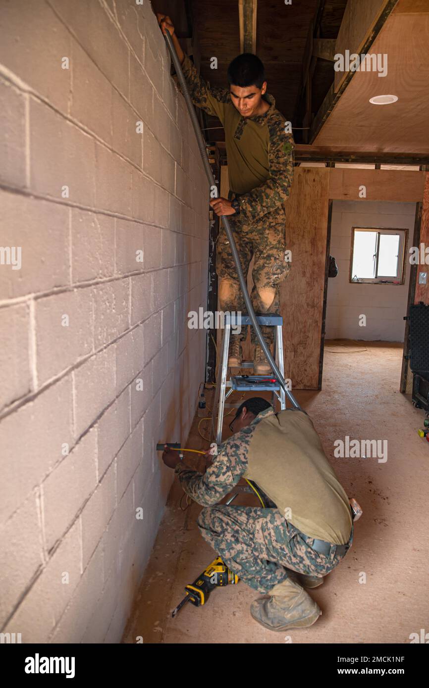 U.S. Marine Corps Lance Cpl. Miguel Vargas, top, and Lance Cpl. Tyrese ...