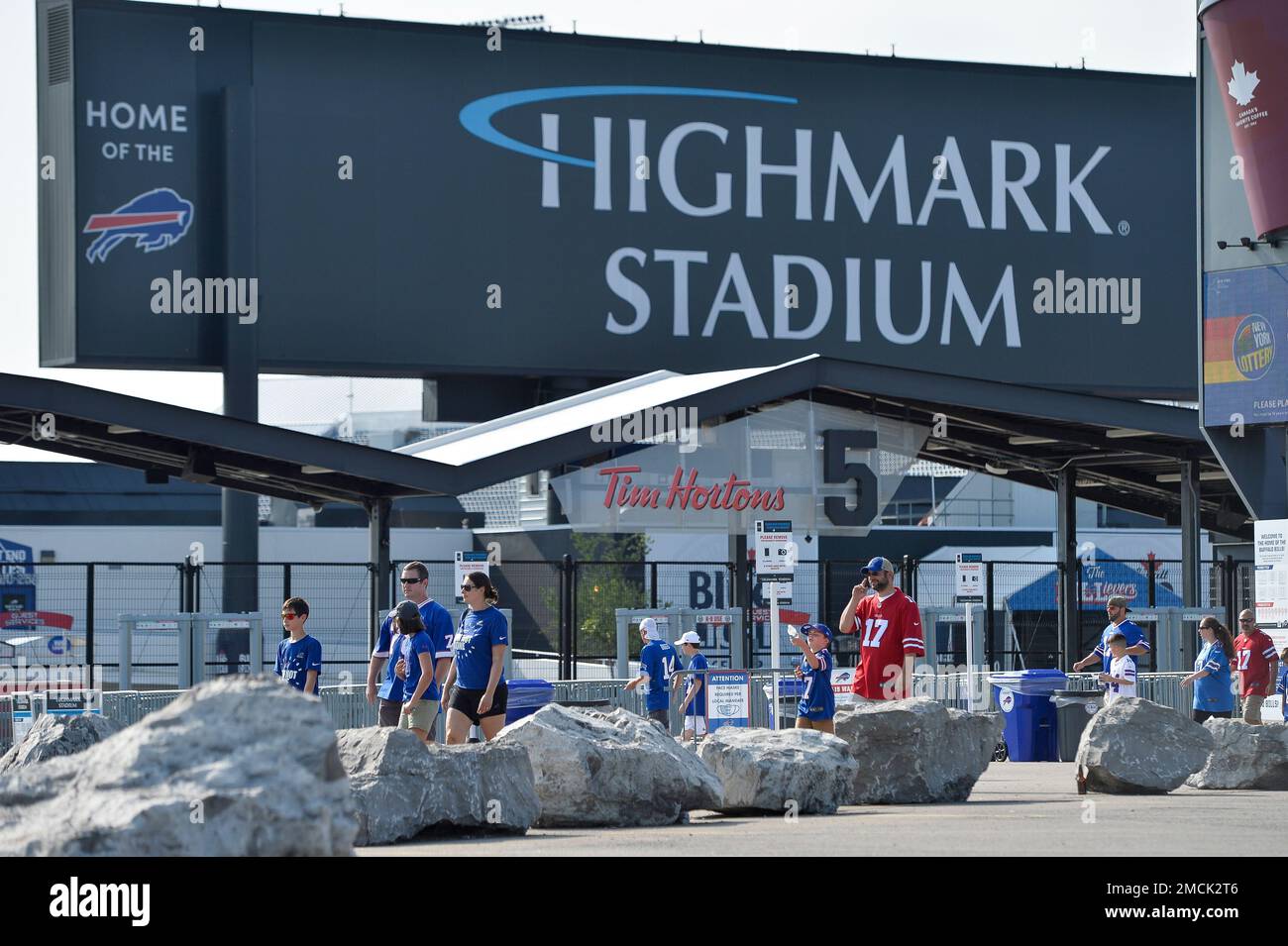FILE - Fans walk outside Highmark Stadium before a preseason NFL ...