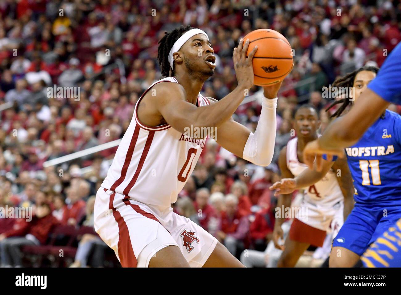 Arkansas guard Stanley Umude (0) shoots against Hofstra during an NCAA ...