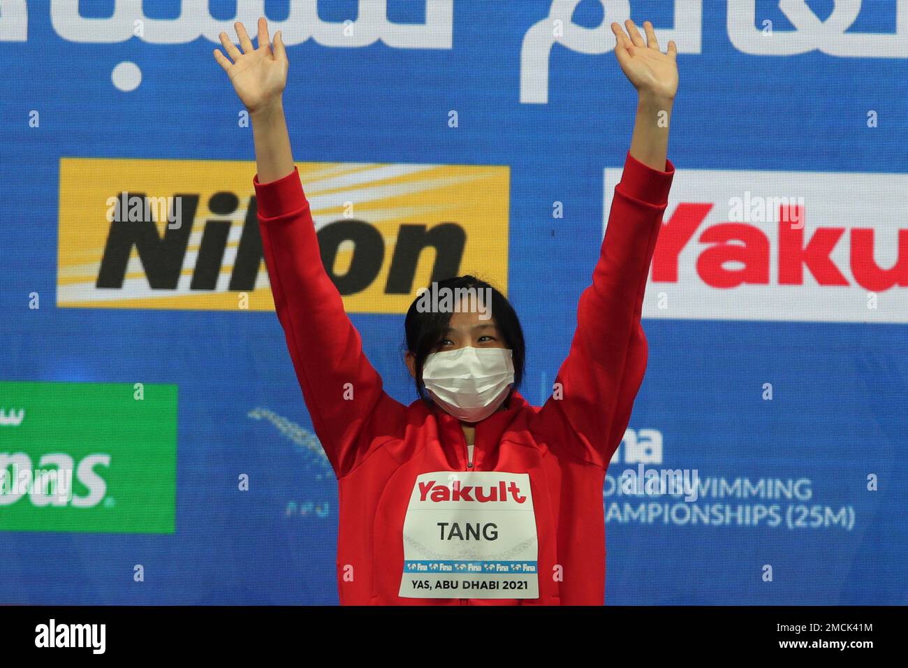 China's Qianting Tang stands on the podium after winning the 100 meters ...