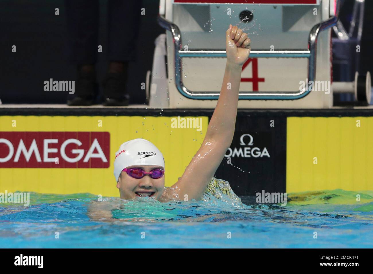 China's Qianting Tang reacts after winning the 100 meters breaststroke ...