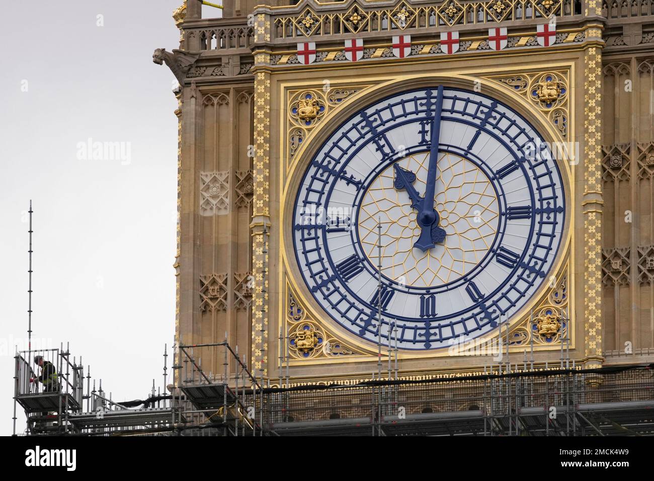 Workmen remove scaffolding around the clock face of the Queen Elizabeth ...